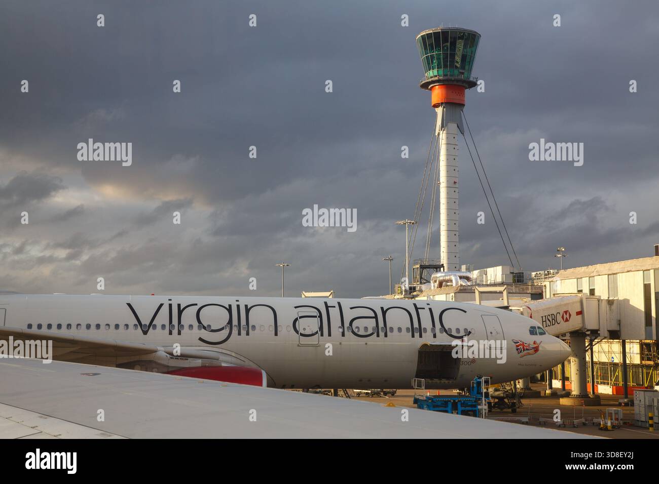 The Control Tower and Airplane wing in Heathrow International Airport ...