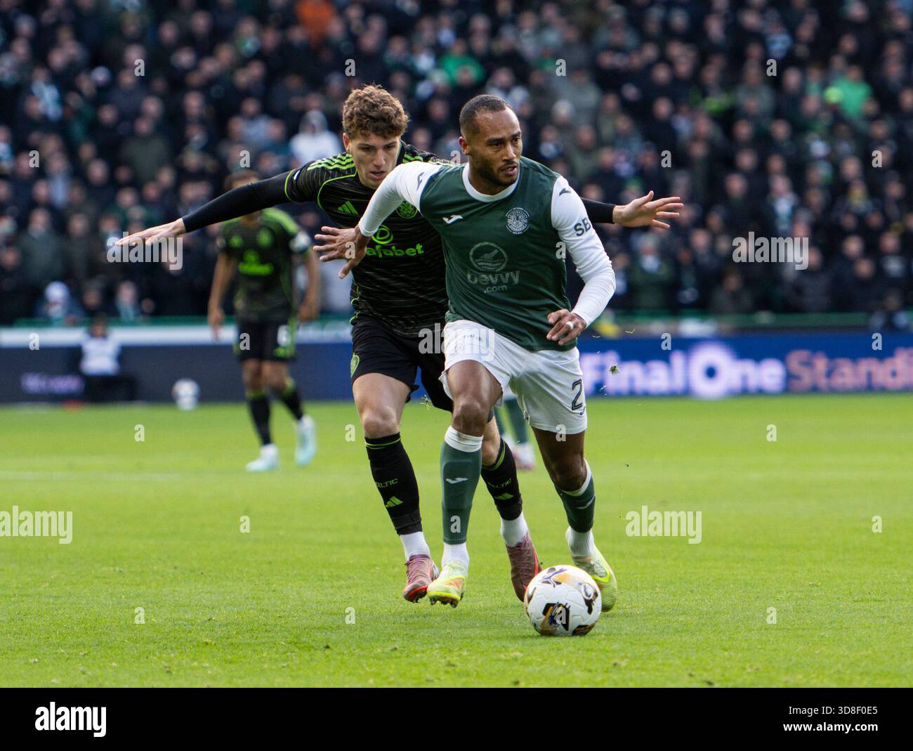 Arne engels of celtic with jordan obita of hibs hi-res stock ...