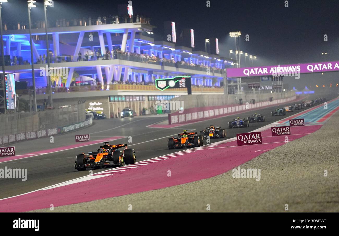 McLaren driver Oscar Piastri leads after the safety car goes back into ...