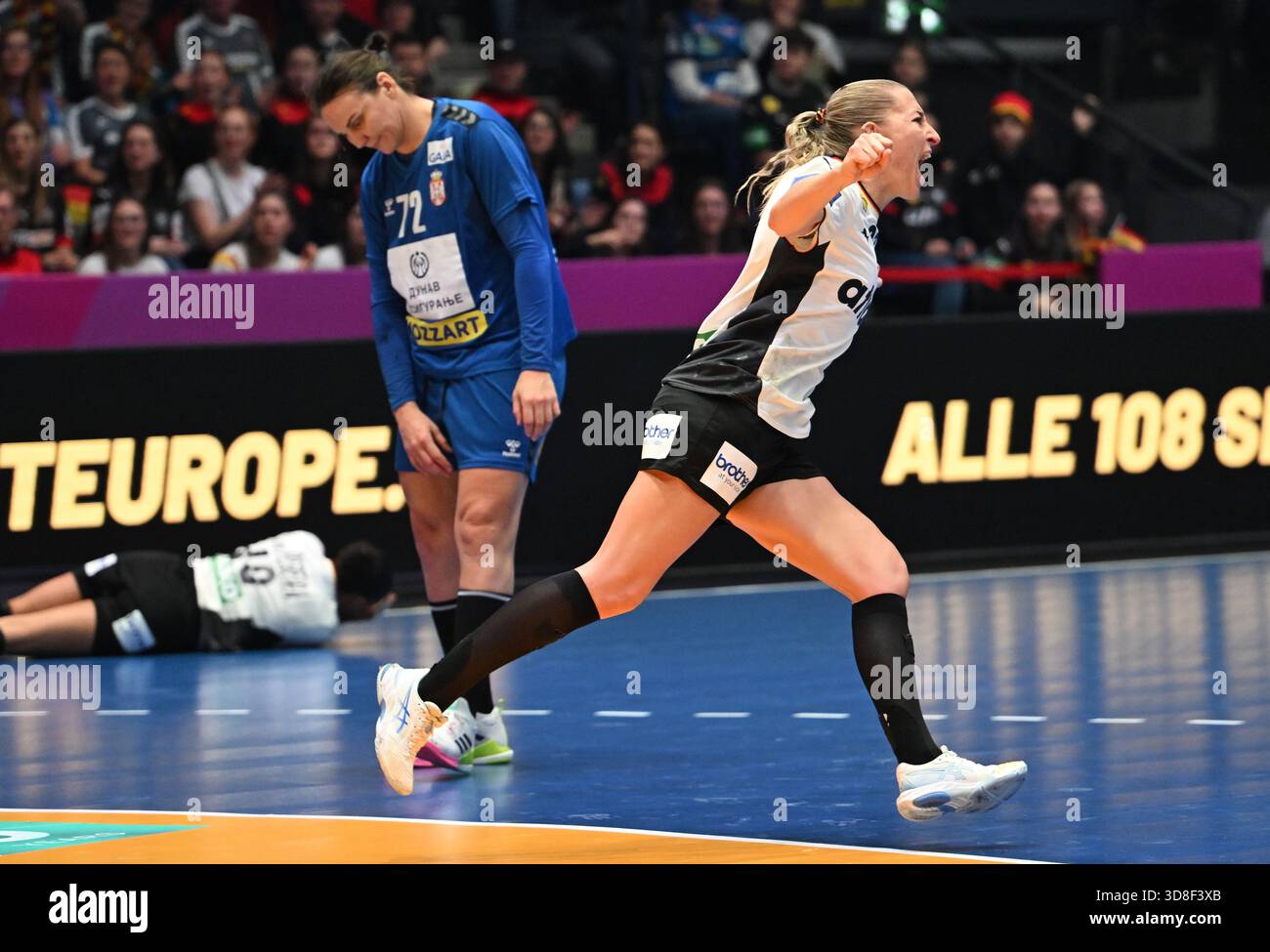 Germany's Jenny Behrend, right, celebrates after scoring a goal during ...