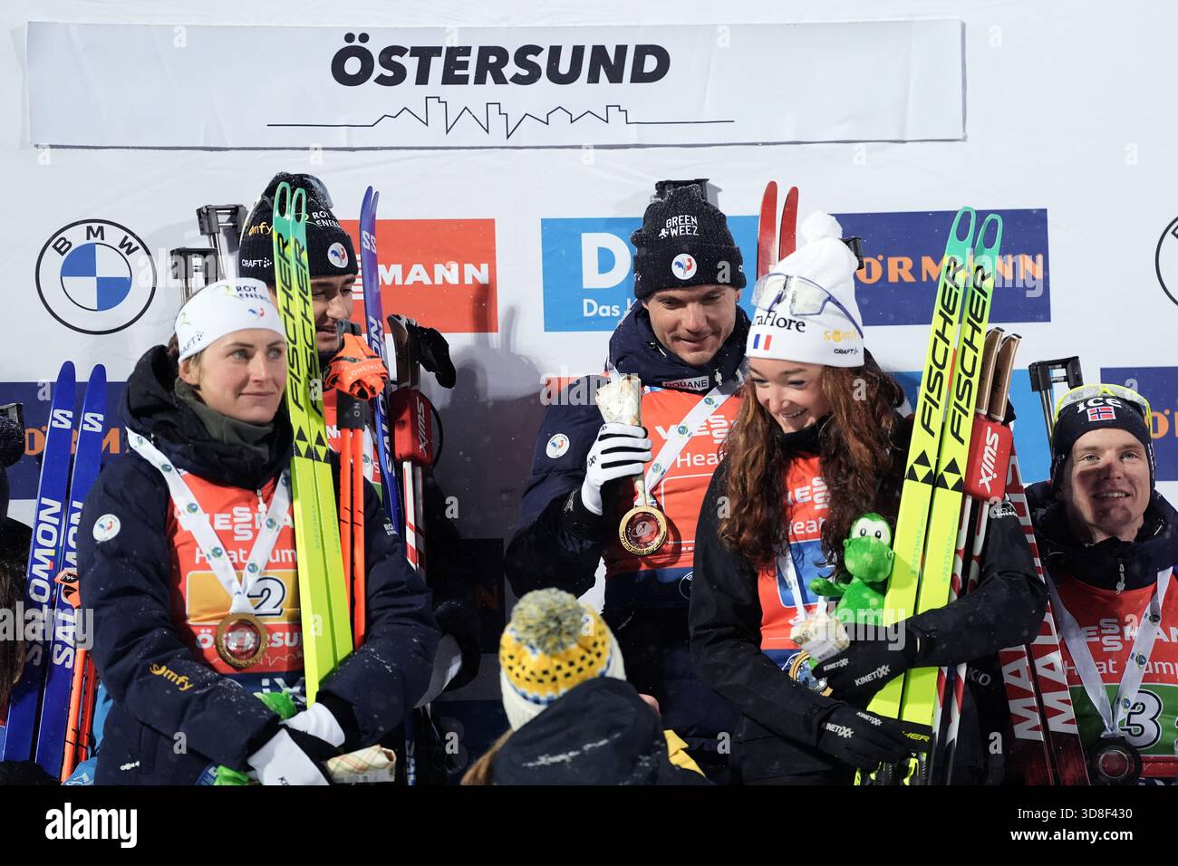 Team France celebrate winning the mixed relay at the mixed relay of the ...