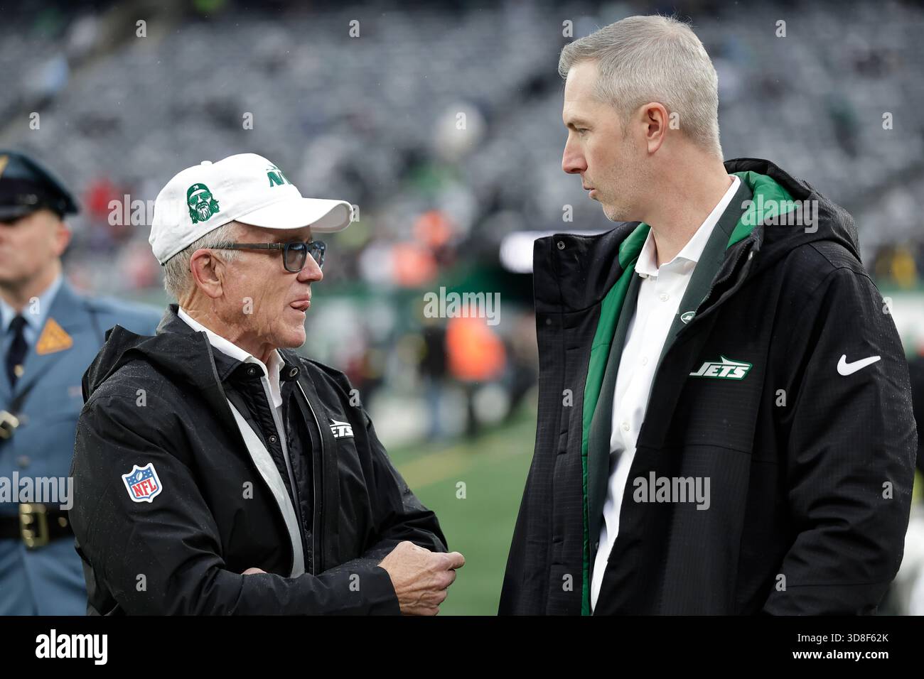 New York Jets co-owner Woody Johnson speaks with General Manager Darren ...