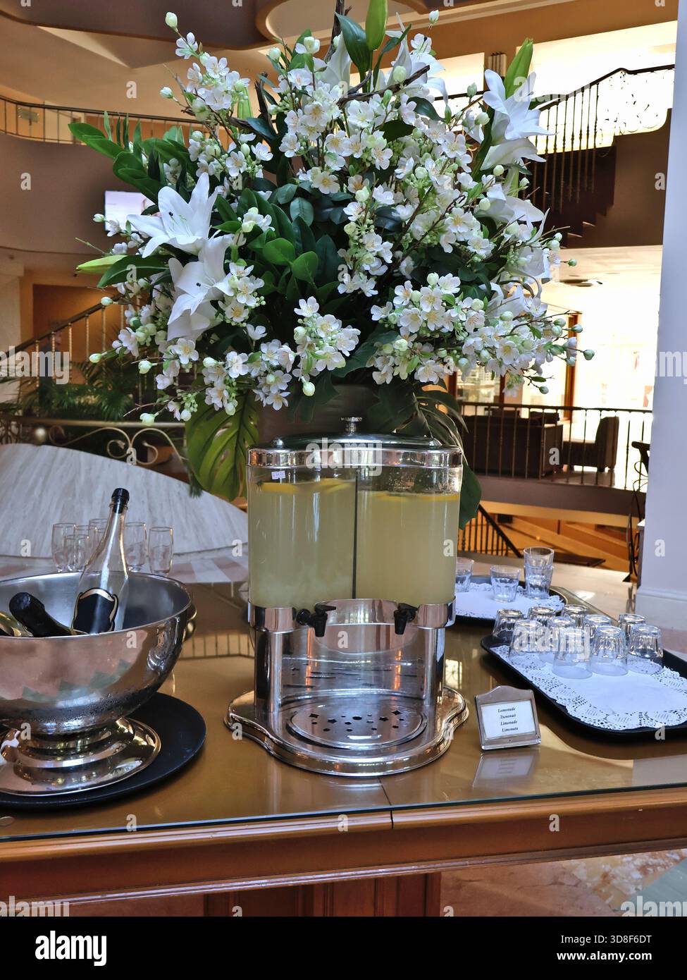 Luxurious hotel lobby event setup featuring a polished beverage station ...