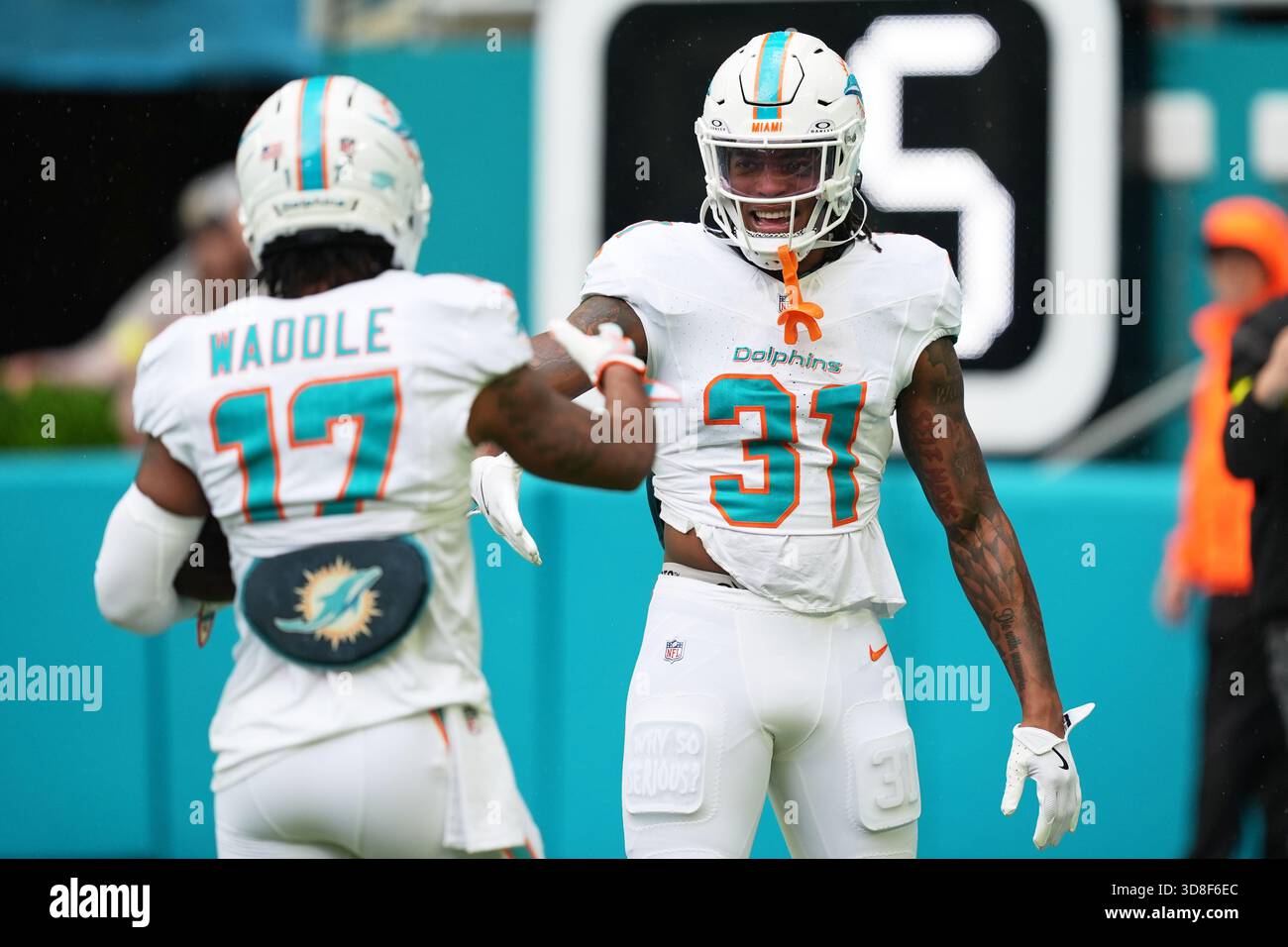 Miami Dolphins running back Ollie Gordon II (31) and wide receiver ...