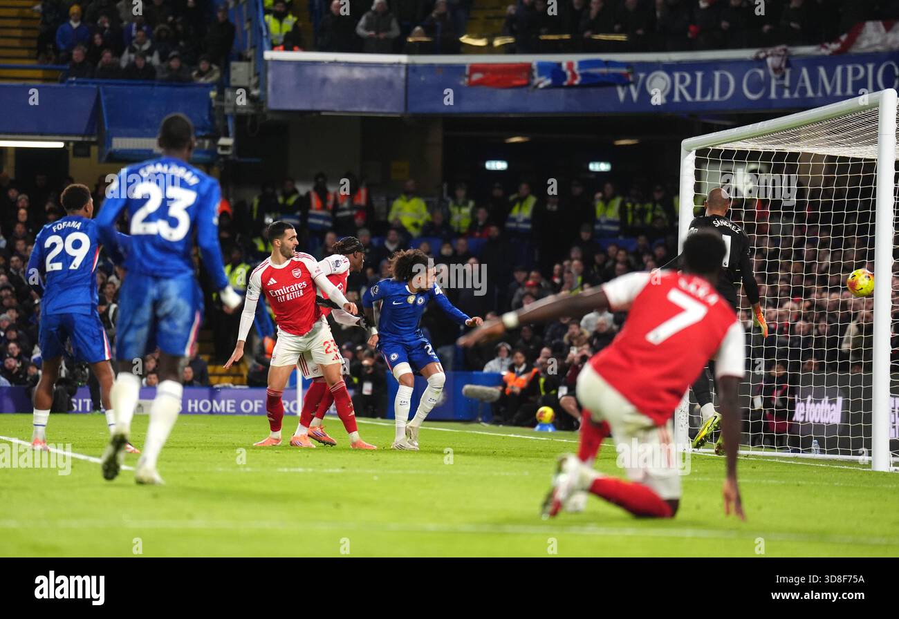 Arsenal's Mikel Merino (third left) scores their side's first goal of ...