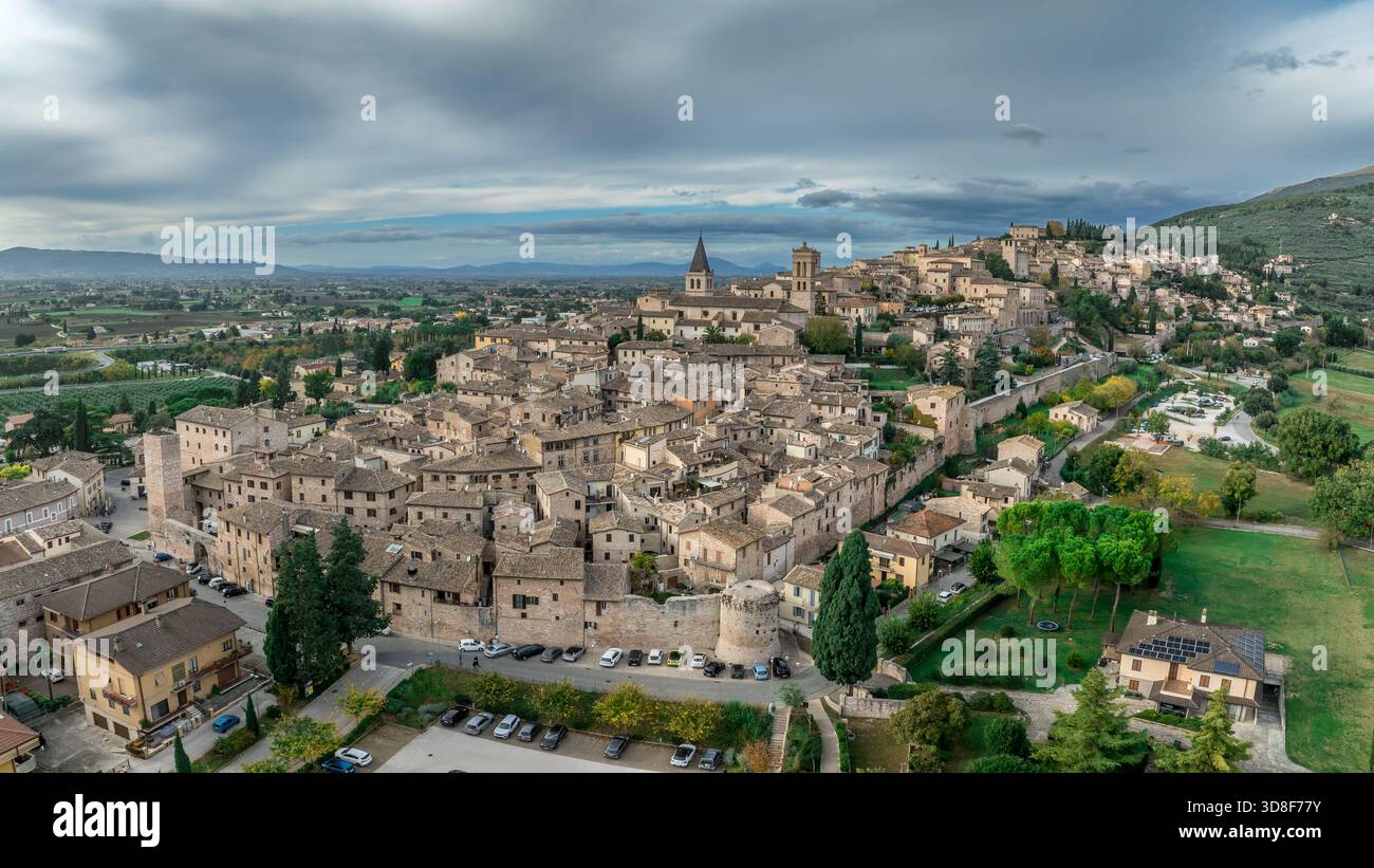 Aerial view of Spello enclosed in a circuit of medieval walls built on ...