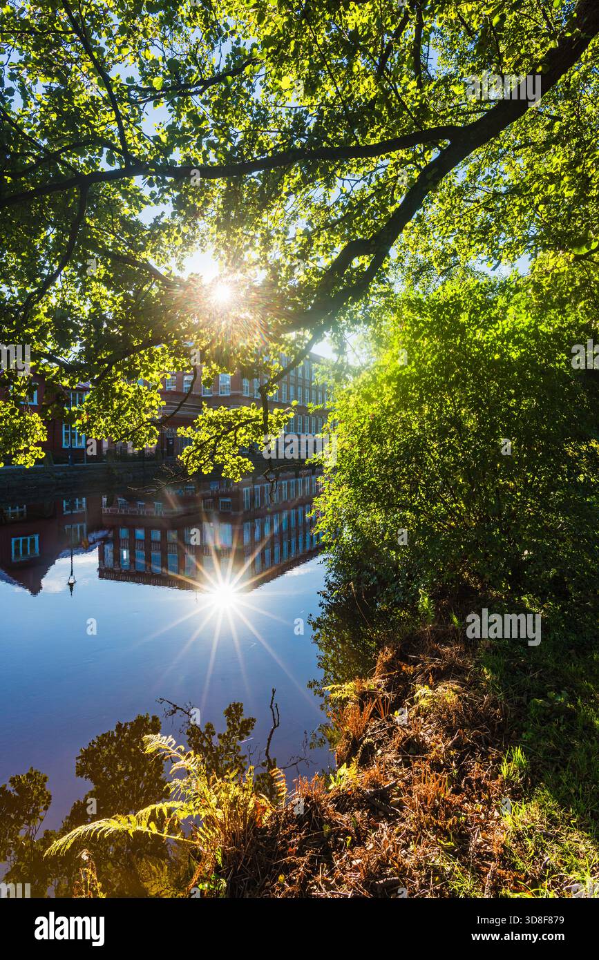 Sunlight sparkles on the surface of the river in Gothenburg, surrounded ...