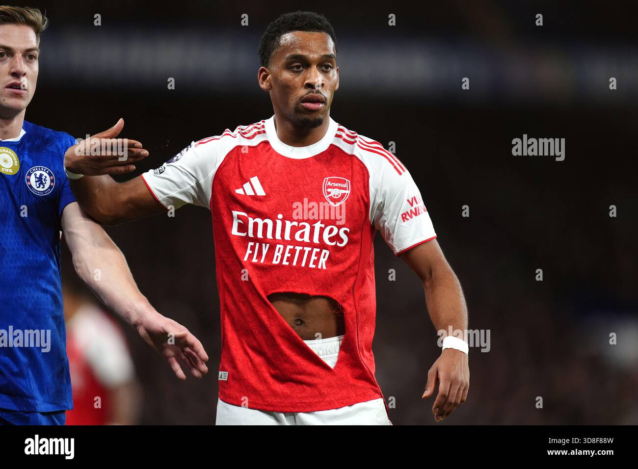 Arsenal's Jurrien Timber with a tear in his shirt during the Premier ...