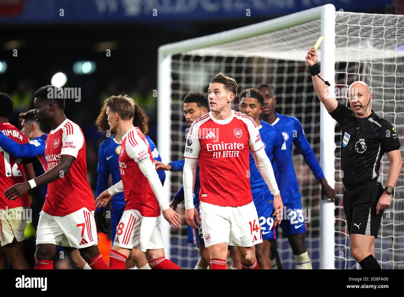 Arsenal's Viktor Gyokeres is shown a yellow card by referee Anthony ...