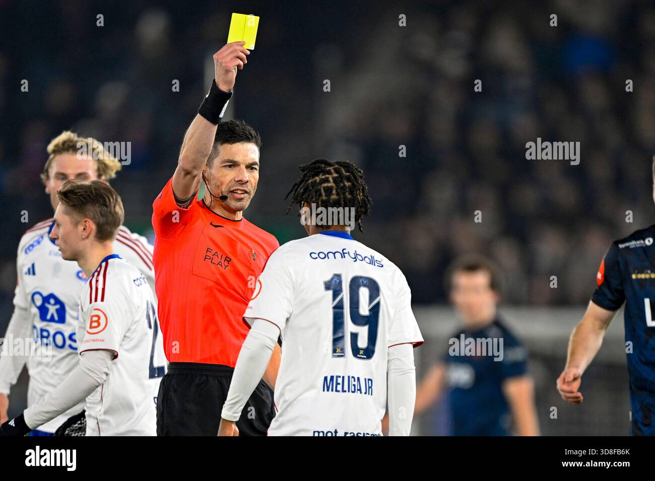 Stavanger 20251130. Referee Tore Hansen gives a yellow card during the ...