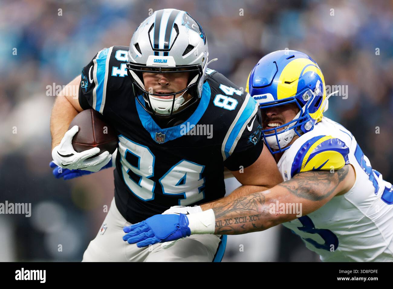Carolina Panthers tight end Mitchell Evans is tackled by Los Angeles ...