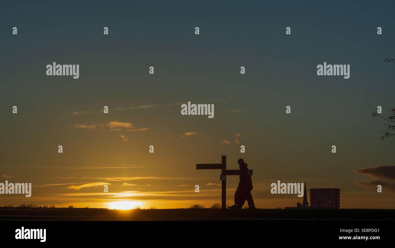 London, England. 30th, November, 2025. London walkers enjoy the winter sunset after a full day ...
