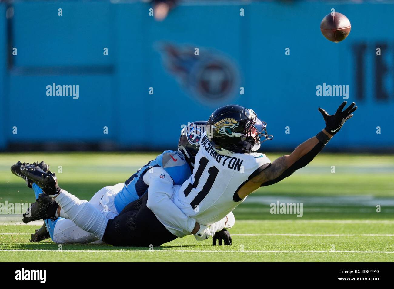 Tennessee Titans cornerback Darrell Baker Jr., left, breaks up a pass ...