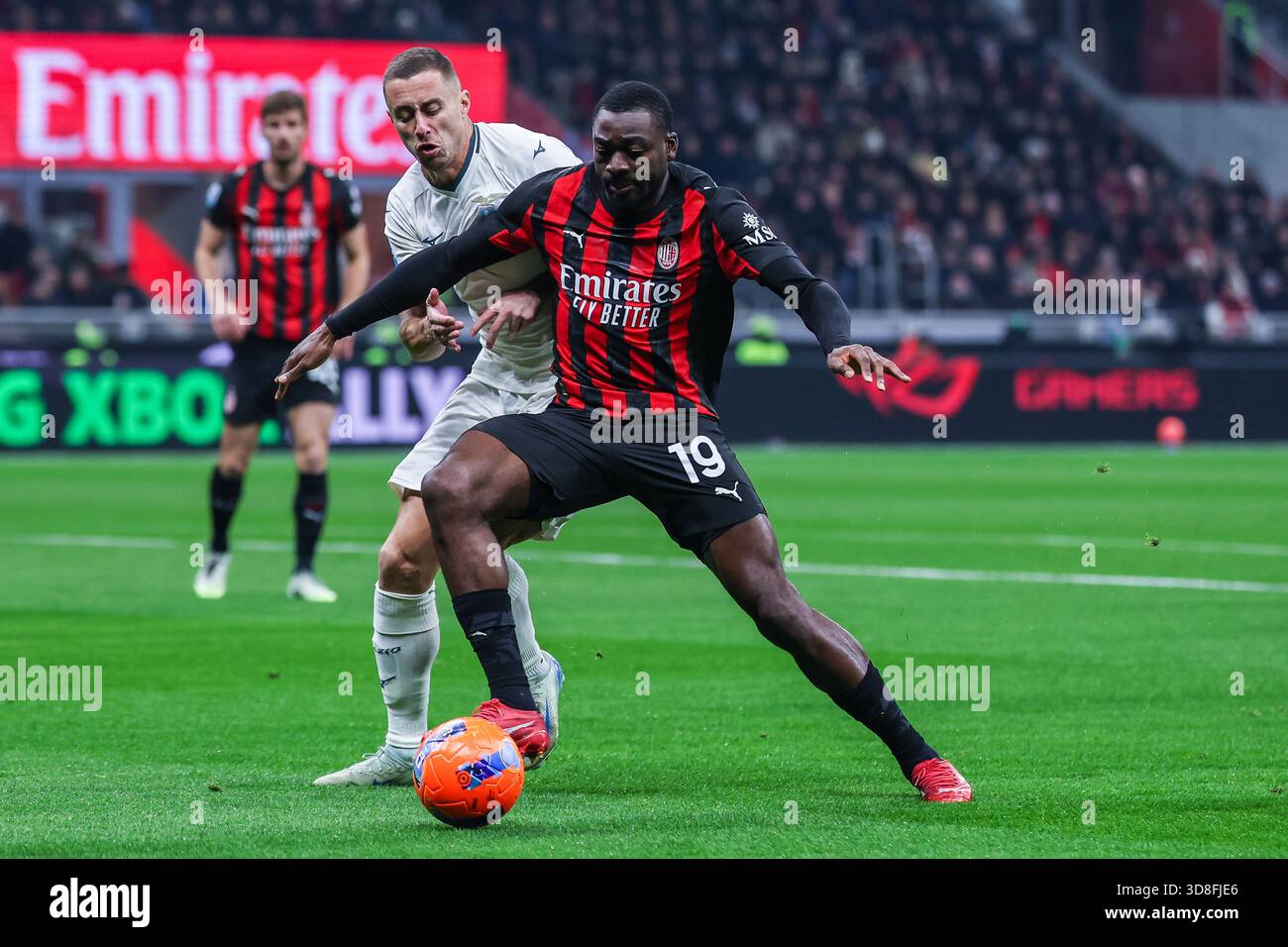 Youssouf Fofana of AC Milan and Adam Marusic of SS Lazio seen in action ...