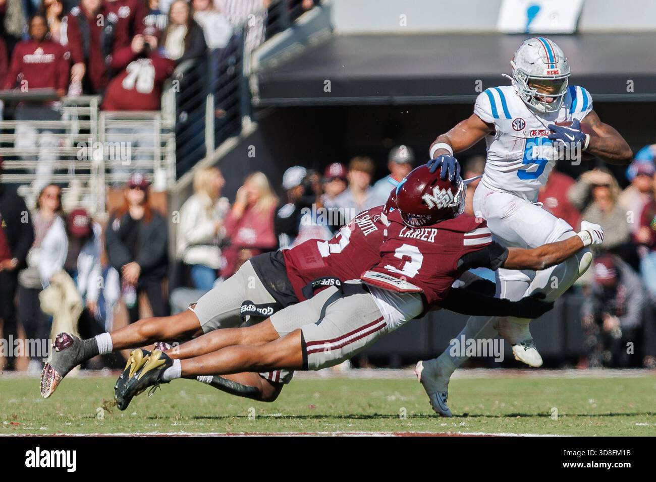 Mississippi Rebels running back Kewan Lacy (5) stiff arms Mississippi ...