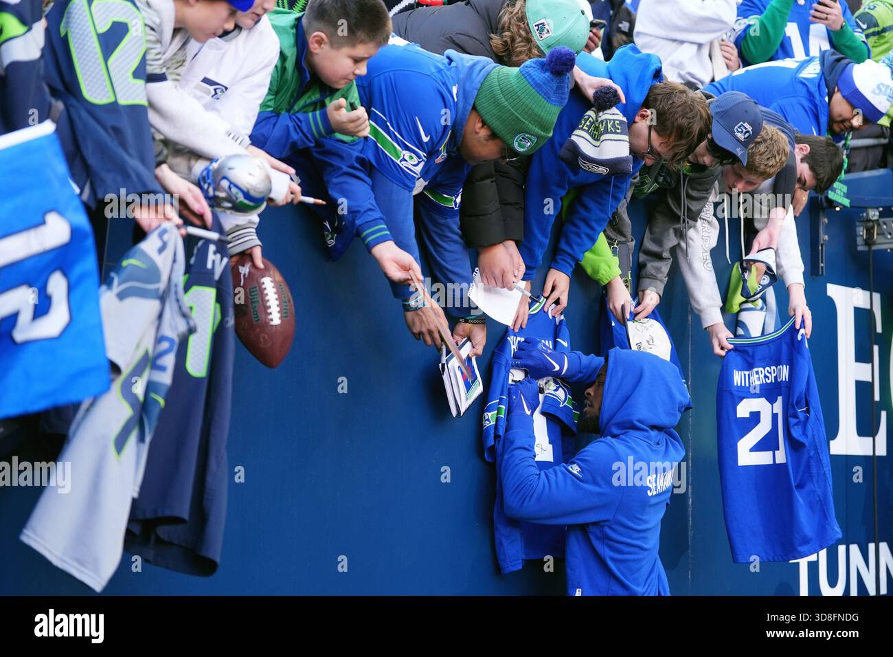 Seattle Seahawks cornerback Devon Witherspoon (21) signs autographs ...