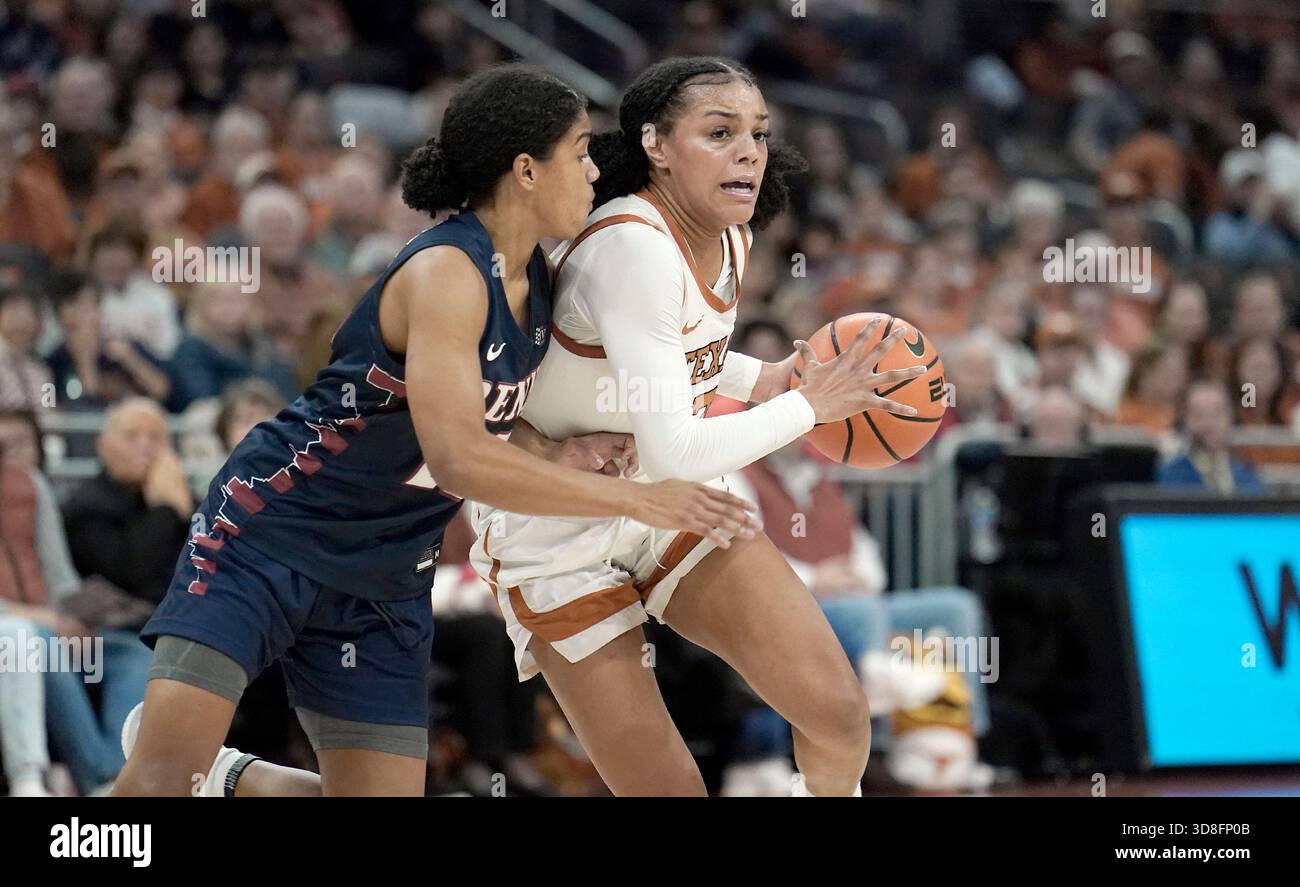 Texas guard Jordan Lee drives to the basket as Penn guard Mataya Gayle ...