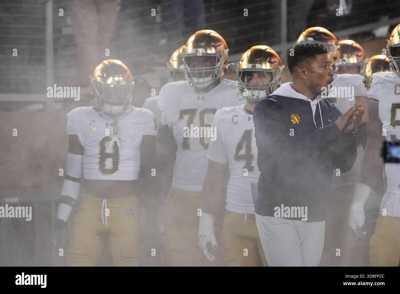 Notre Dame head coach Marcus Freeman gestures to his team before taking ...