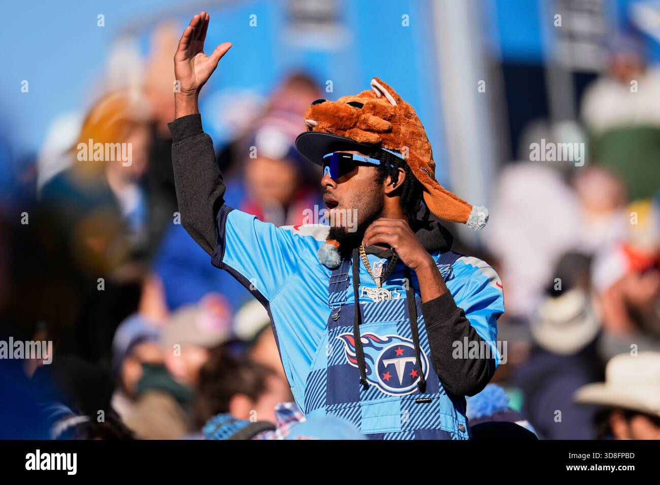 A Tennessee Titans fans cheers during the second half of an NFL ...
