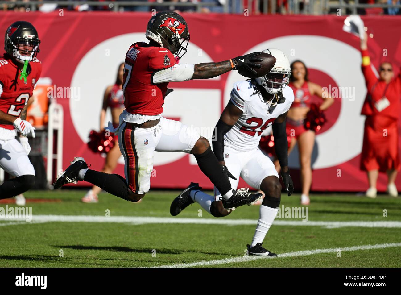 Tampa Bay Buccaneers running back Bucky Irving, center, runs past ...