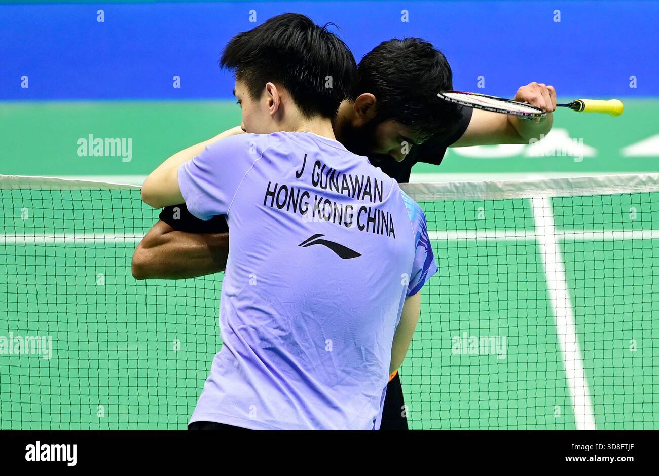 LUCKNOW, INDIA - NOVEMBER 30: Jason Gunawan (HKG) hugs Kidambi Srikanth ...