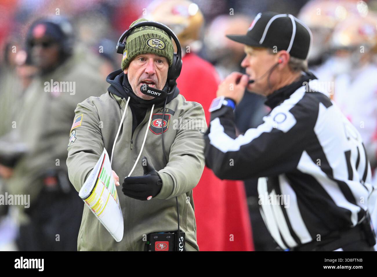 San Francisco 49ers head coach Kyle Shanahan, left, gestures toward an ...