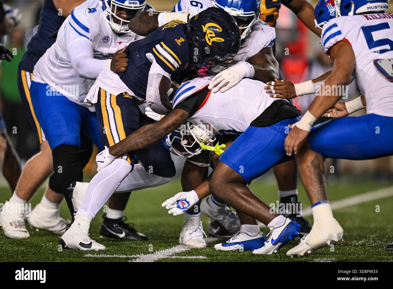 California running back Kendrick Raphael (1) is tackled by SMU safety ...