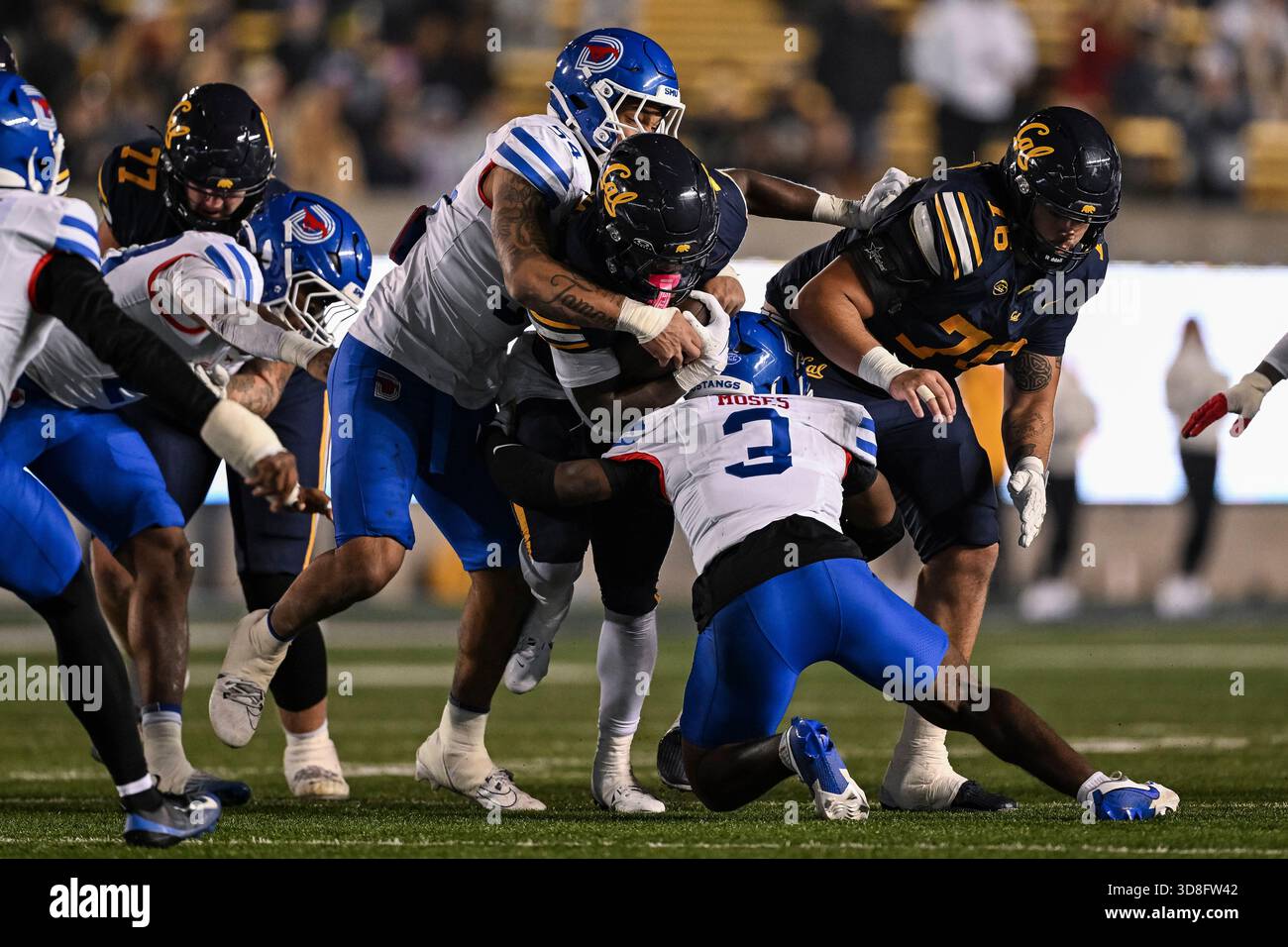 California running back Kendrick Raphael (1) is tackled by SMU ...