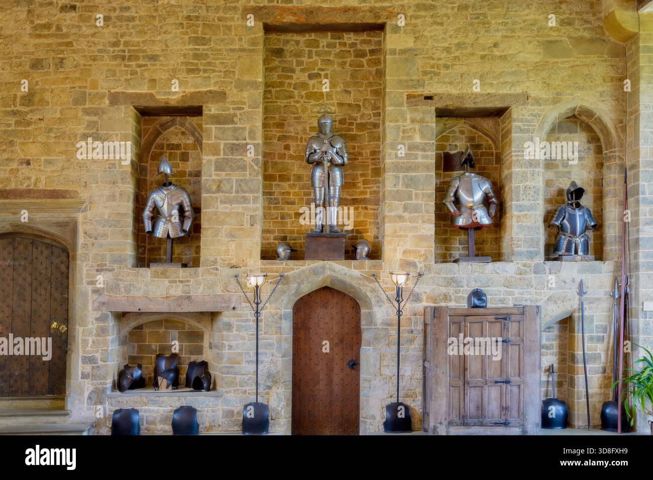 The Great Hall in Broughton Castle includes displays of arms and armour ...