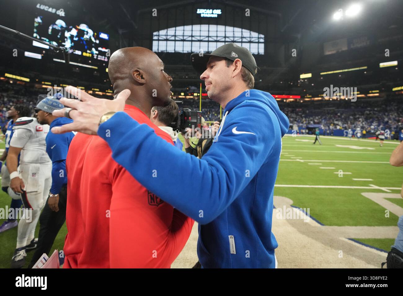 Houston Texans head coach DeMeco Ryans, left, shakes hands with ...