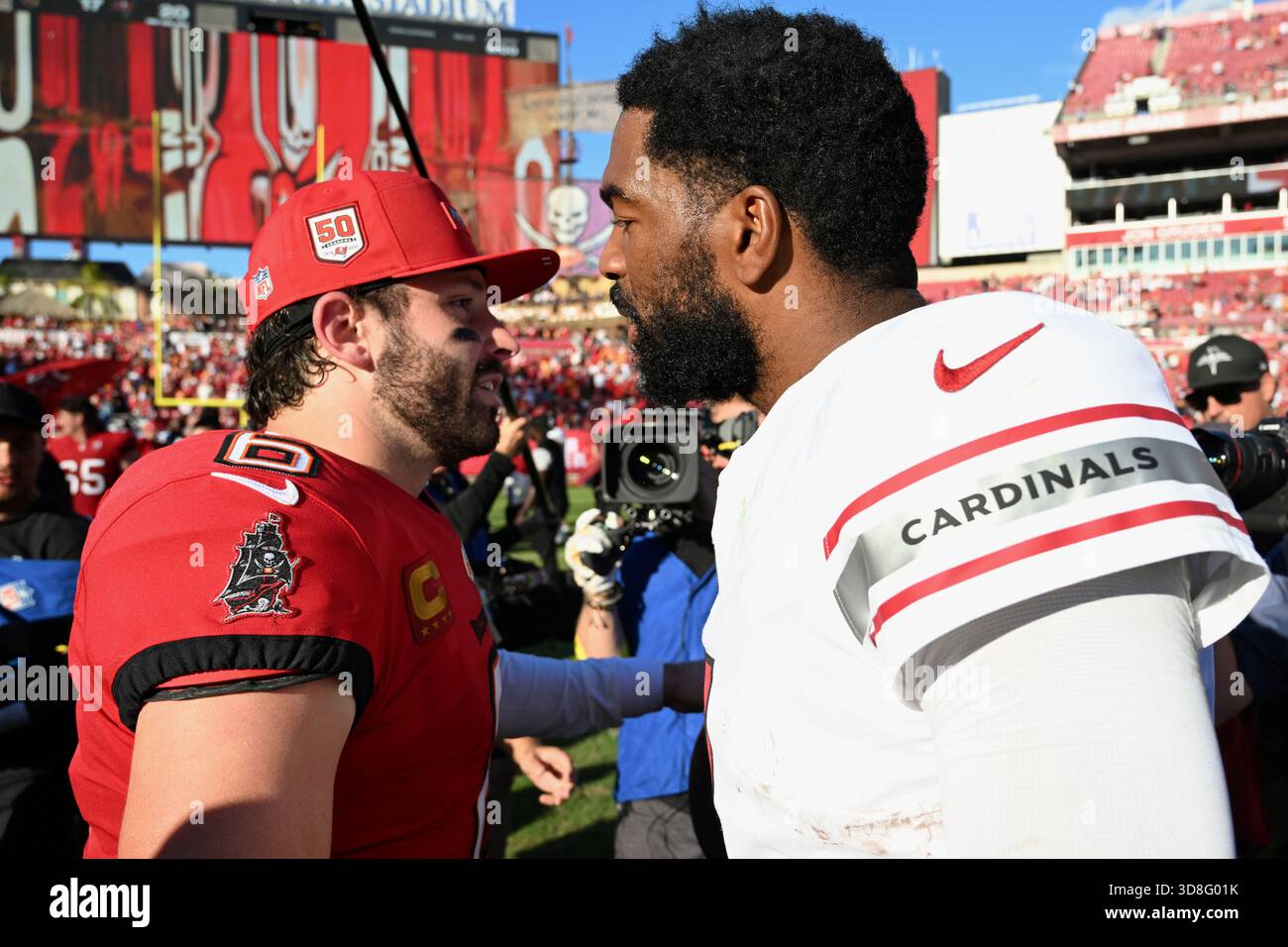 Arizona Cardinals quarterback Jacoby Brissett, right, talks with Tampa ...