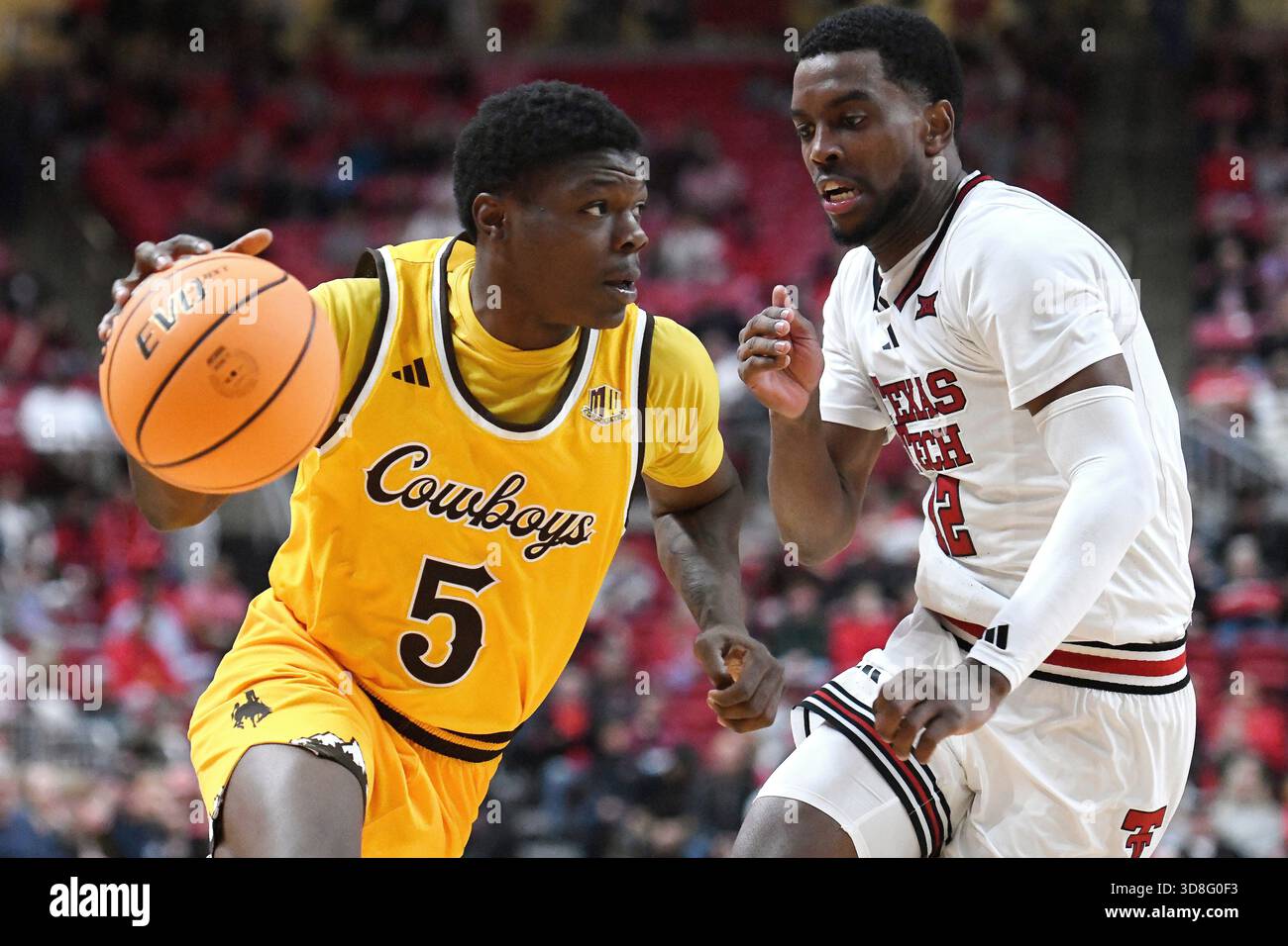 Wyoming guard Leland Walker (5) dribbles the ball while Texas Tech ...