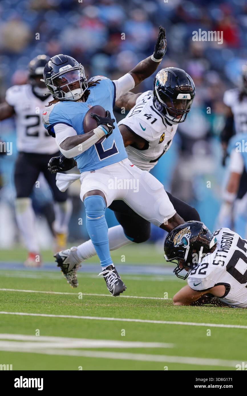 Tennessee Titans running back Tyjae Spears (2) is tackled by ...
