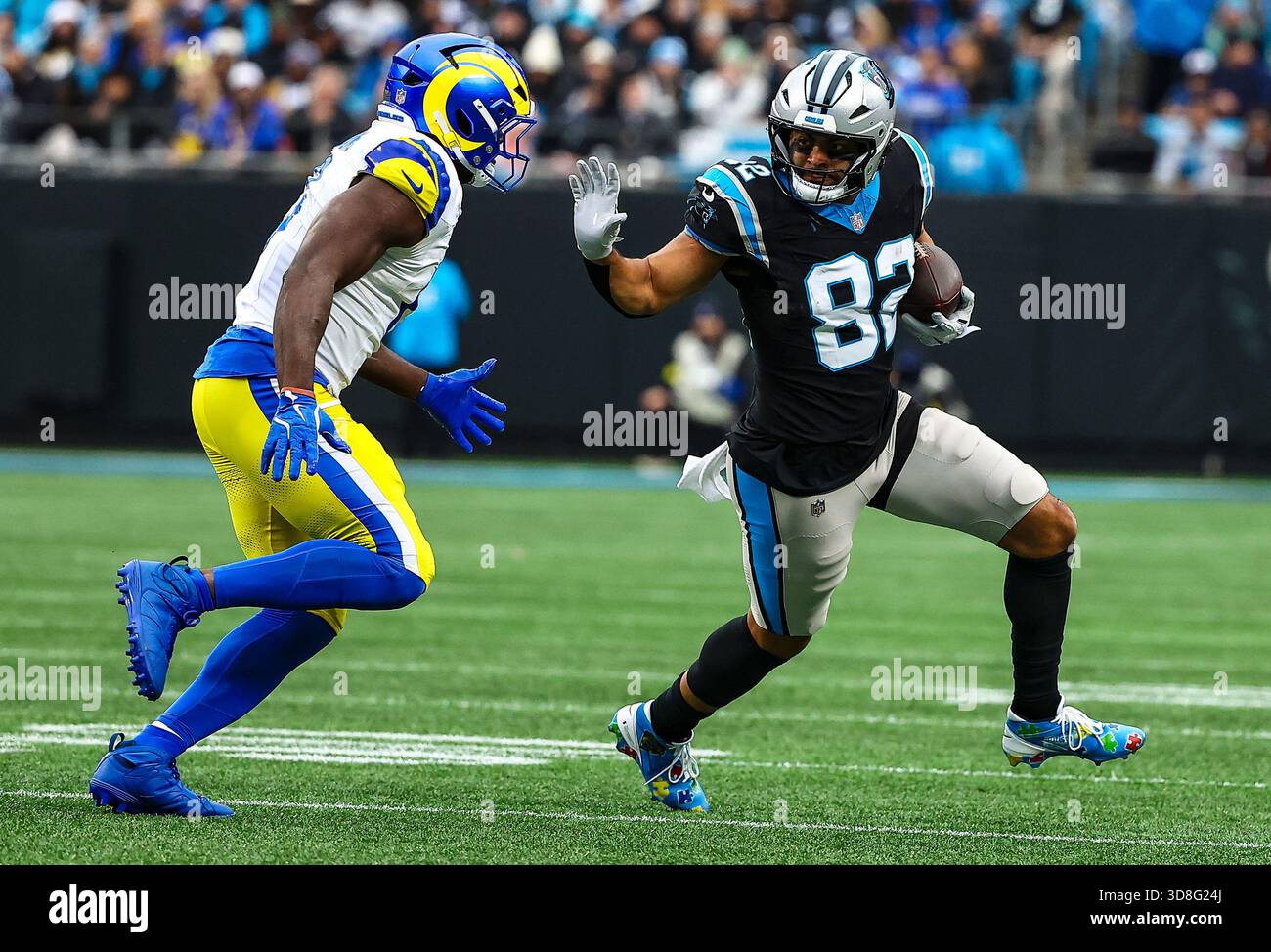 November 30, 2025: Carolina tight end Tommy Tremble (82) stiff arms Los ...