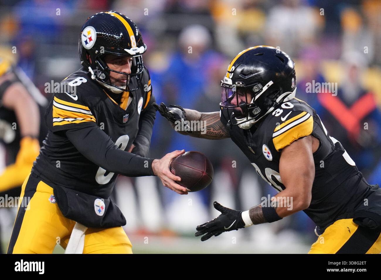 Pittsburgh Steelers quarterback Aaron Rodgers (8) hands off to running ...