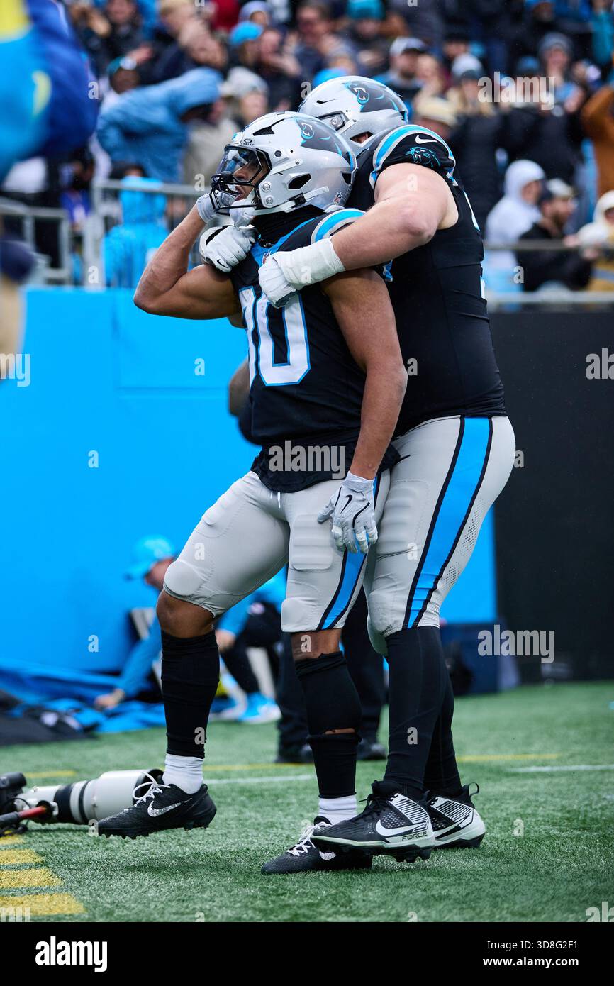 Carolina Panthers running back Chuba Hubbard (30) is hugged by teammate ...