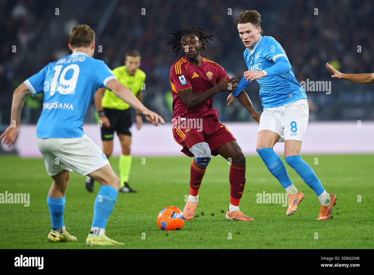 Rome, Italy. 30th Nov, 2025. Manu Kone' of Roma vies for the ball with ...