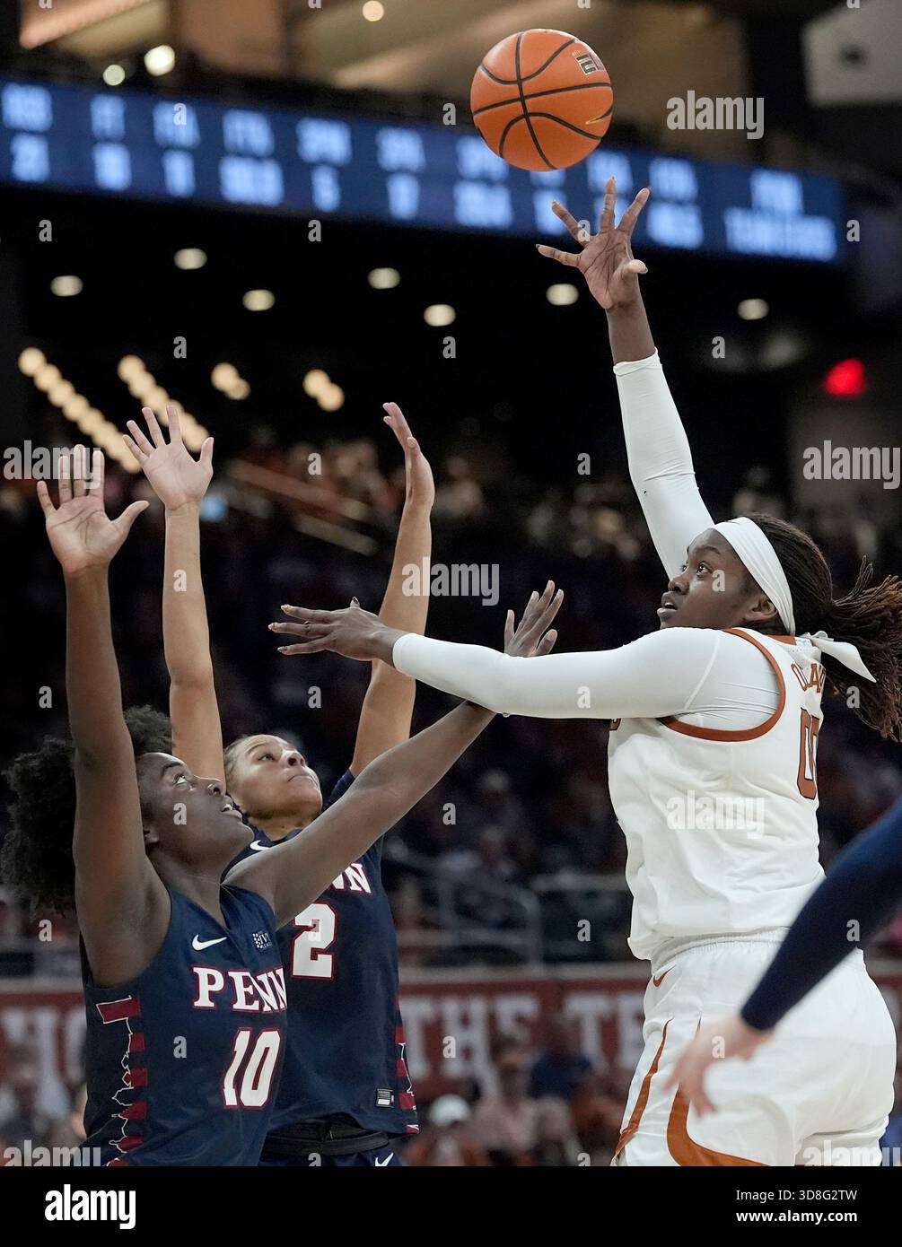 Texas forward Kyla Oldacre shoots over Penn center Tina Njike and guard Brook Suttle during the ...