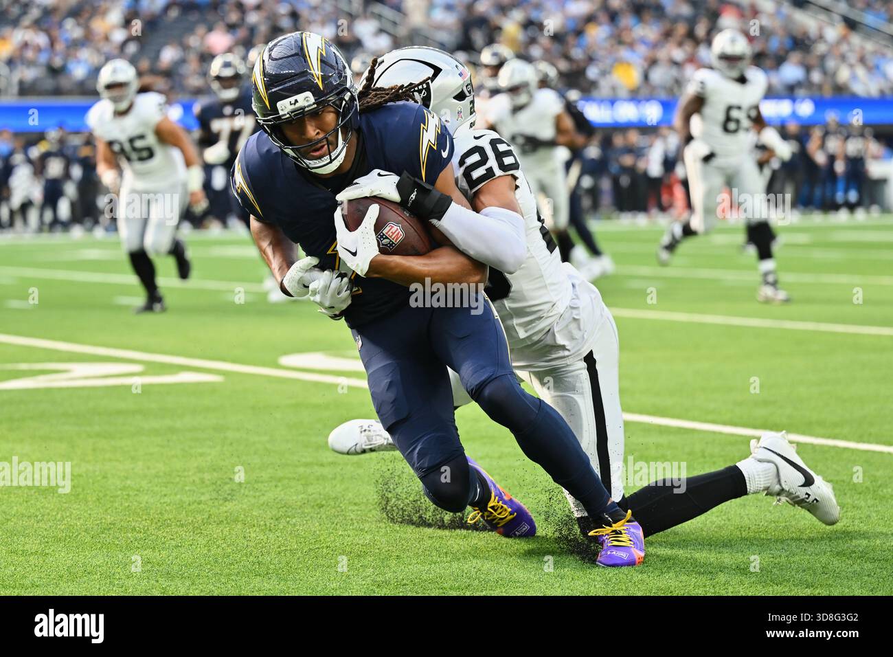 Los Angeles Chargers wide receiver Quentin Johnston (1) is tackled by ...