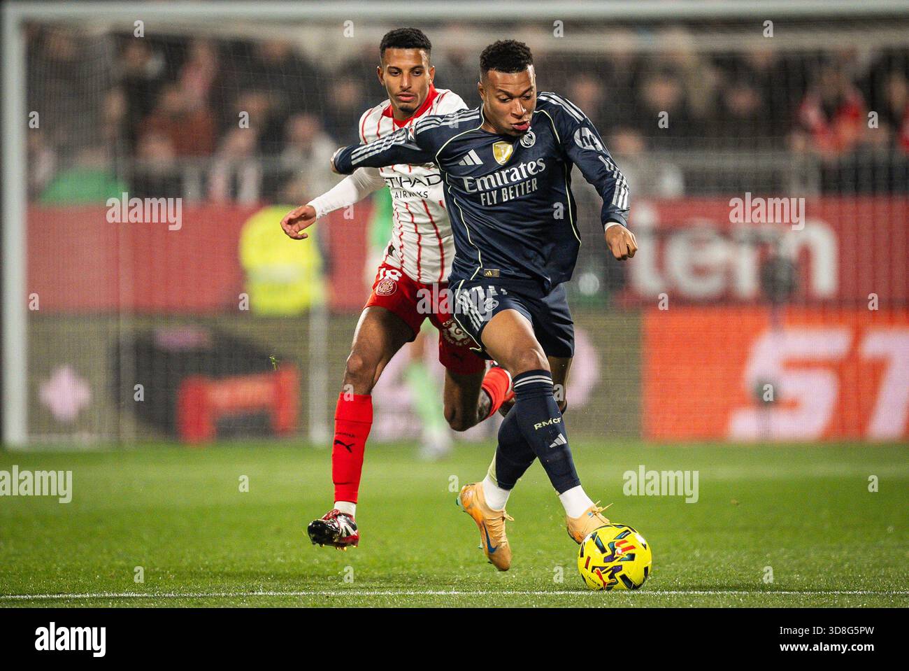 Azzedine OUNAHI of Girona and Kylian MBAPPE of Real Madrid during the ...
