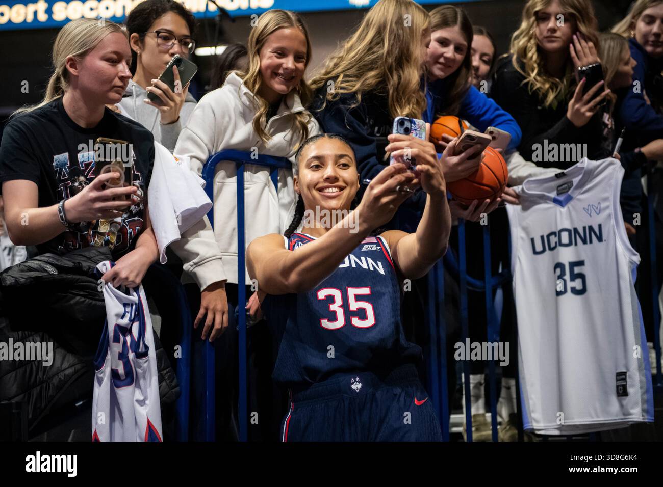 UConn Huskies guard Azzi Fudd (35) takes a selfie with a fan after ...