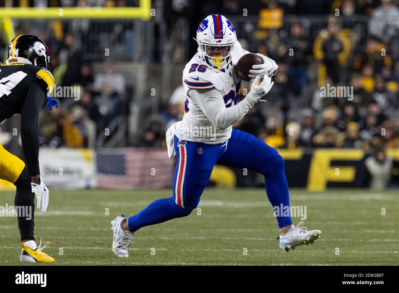 Buffalo Bills running back Ty Johnson (26) runs after a catch during an ...