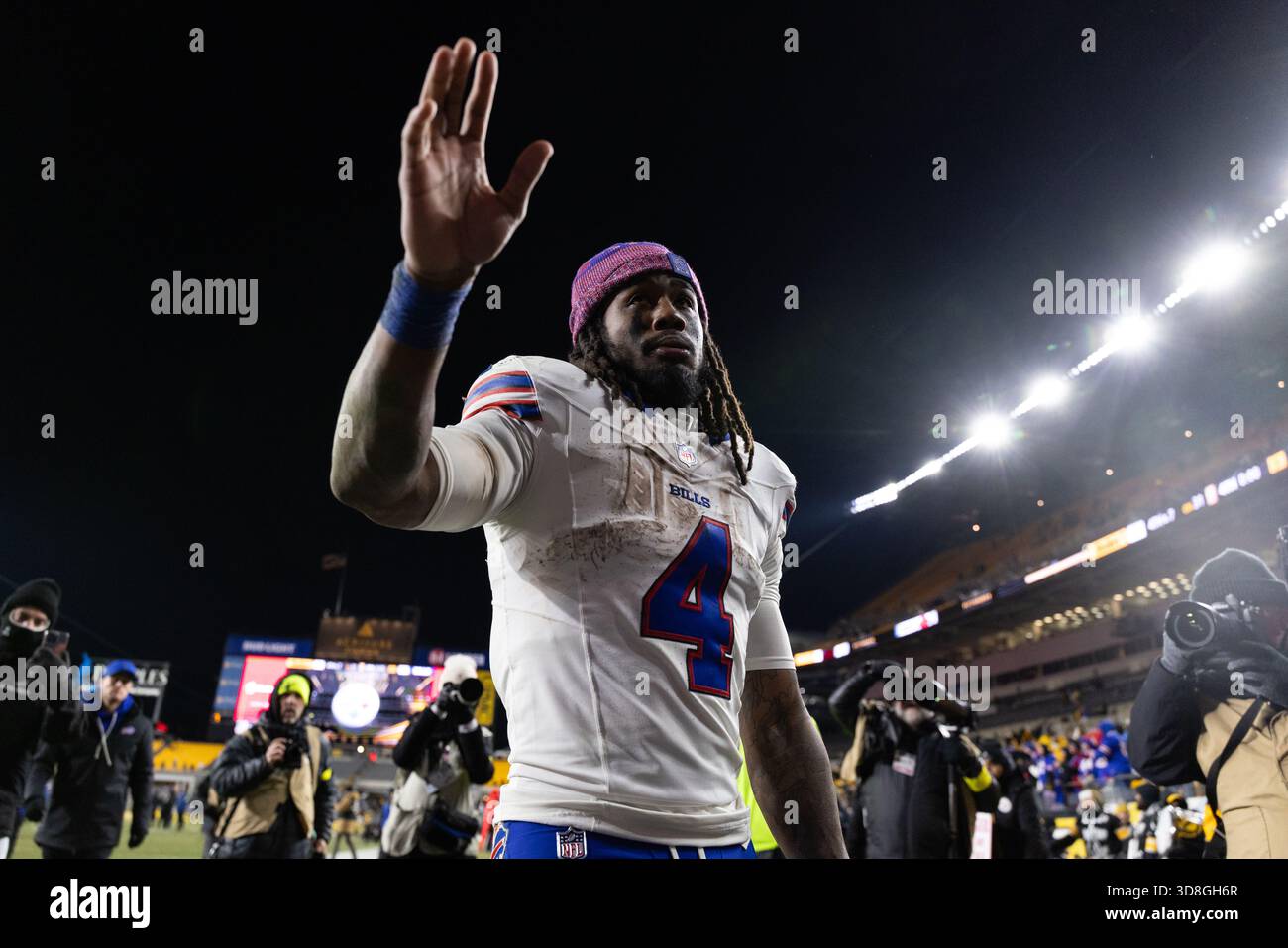 Buffalo Bills running back James Cook III (4) waves to fans after an ...