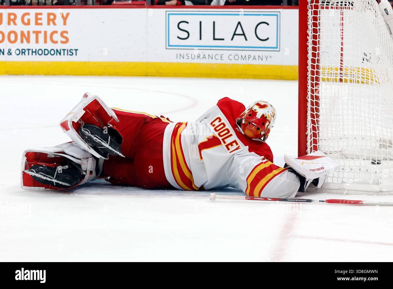 Calgary Flames goaltender Devin Cooley reacts after allowing a goal by ...