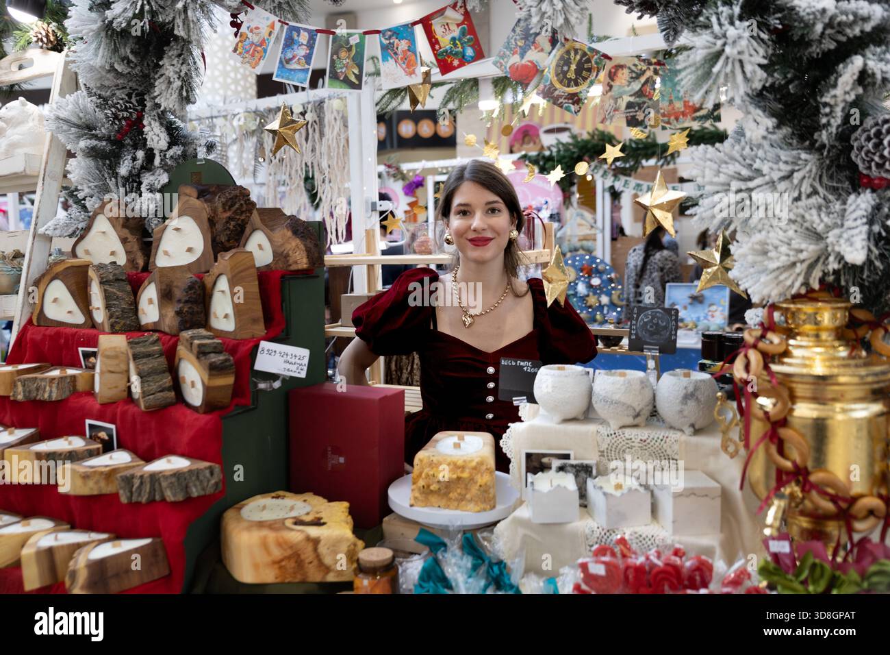 (251201) -- VLADIVOSTOK, Dec. 1, 2025 (Xinhua) -- A woman sells handicrafts at a handicrafts ...