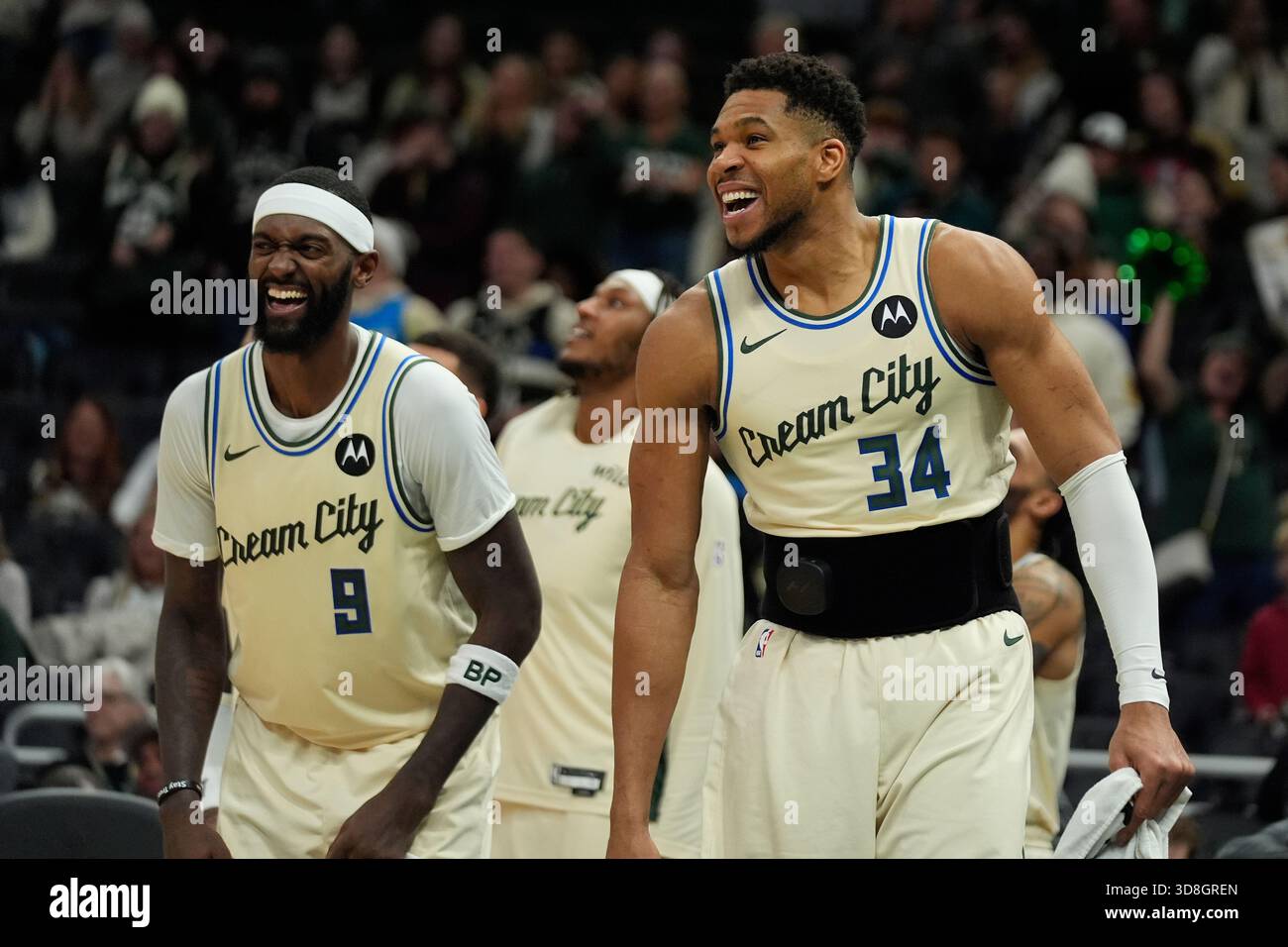 Milwaukee Bucks' Giannis Antetokounmpo and Bobby Portis smile from the ...