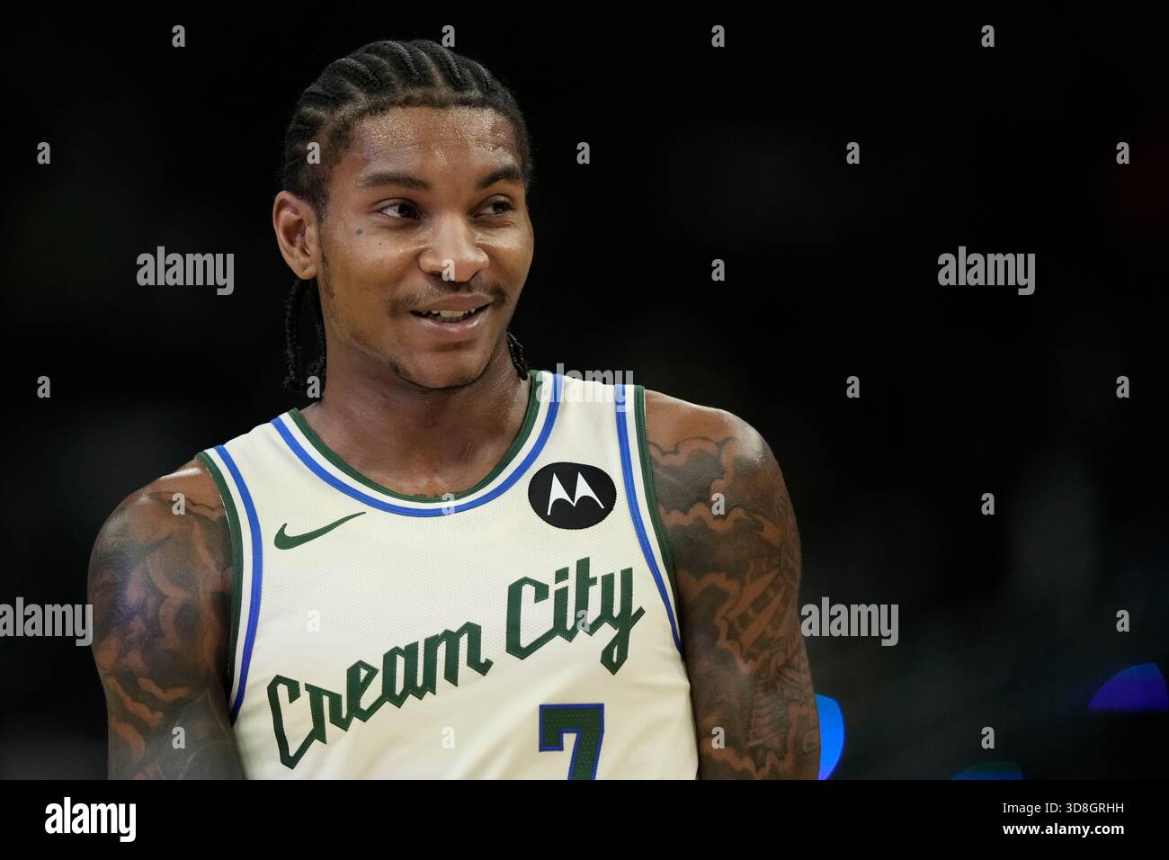 Milwaukee Bucks' Kevin Porter Jr. smiles during an NBA basketball game ...