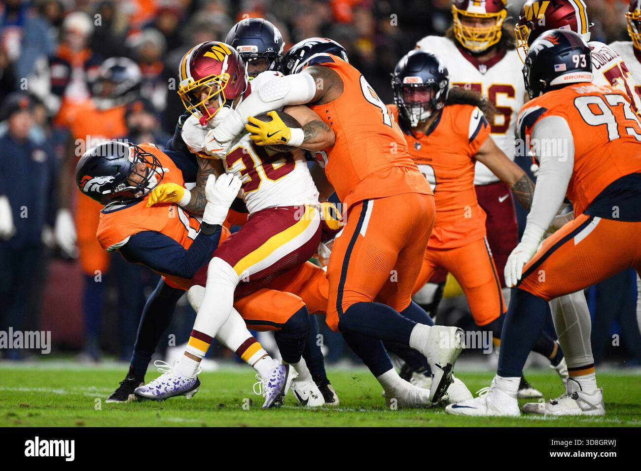 Washington Commanders running back Chris Rodriguez Jr. (36) is stopped ...