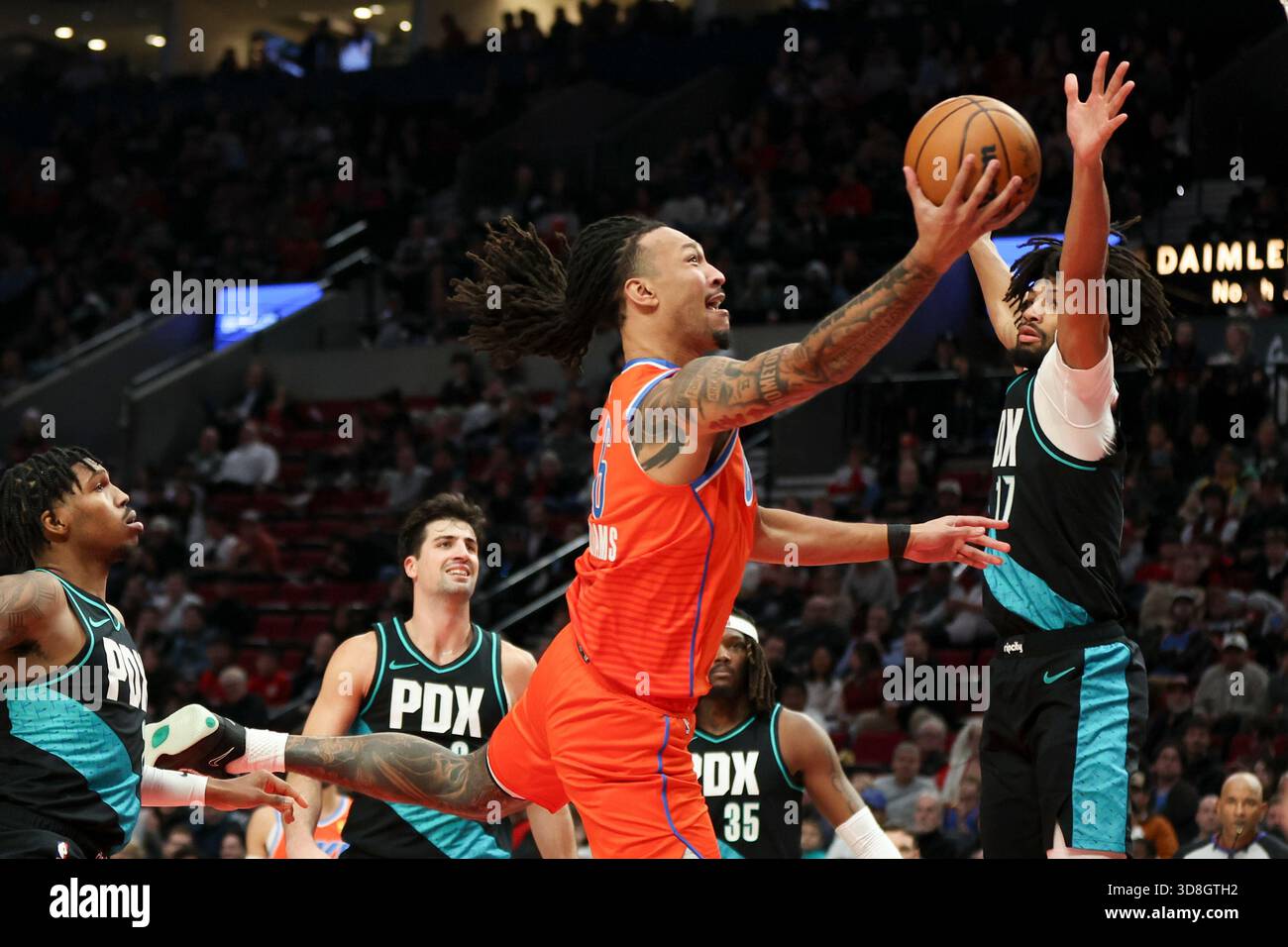 Oklahoma City Thunder forward Jaylin Williams, center, shoots beside ...