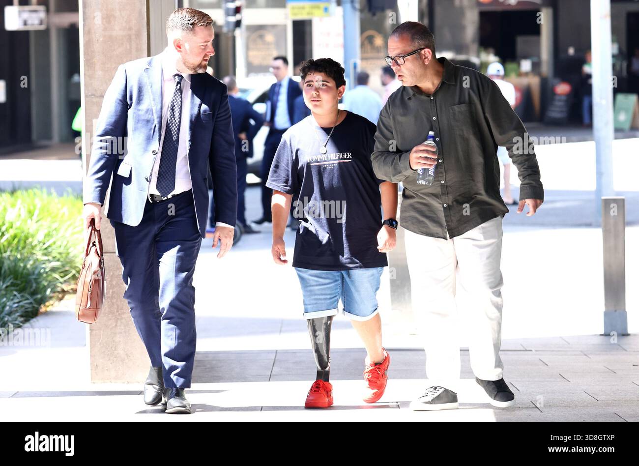 Nicholas Tadros (C) arrives with father Simon (Right) for the Coroners ...
